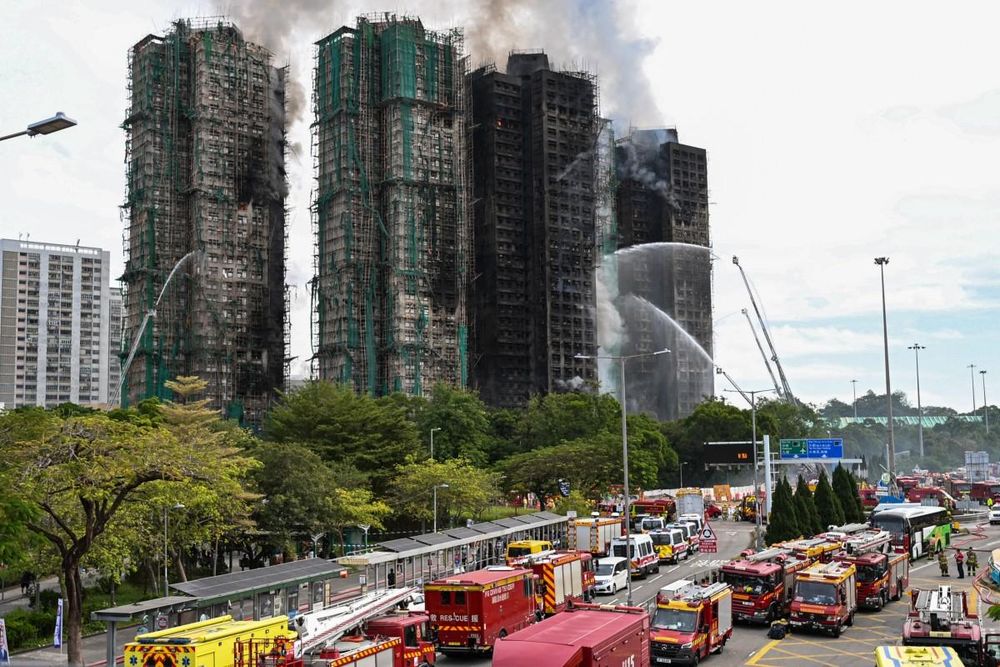 GRAPHIC: Many dead and missing in Hong Kong multiple tower block inferno