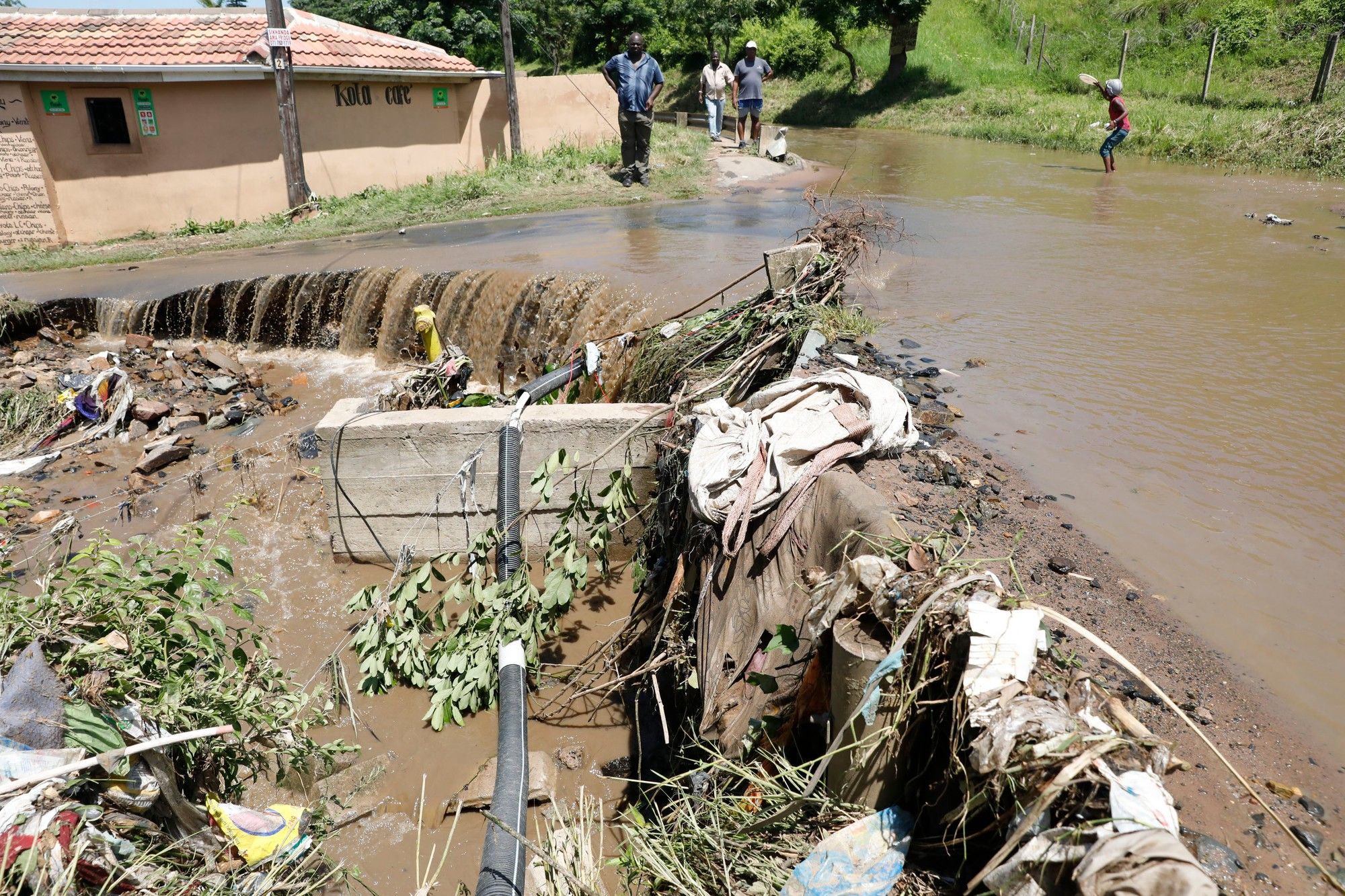 5 dead, 2 missing and mop up operations begin as dozens of homes ...
