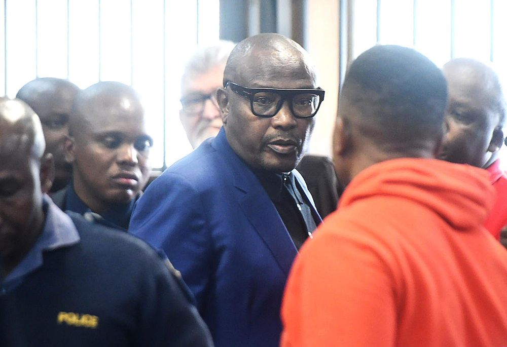 Katiso KT Molefe's armed bodyguards, carrying semi-automatic AKM rifles ...