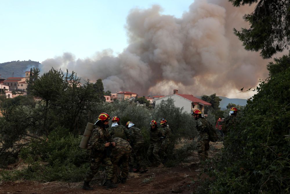 Greece's fire-ravaged island now racing to build flood defences