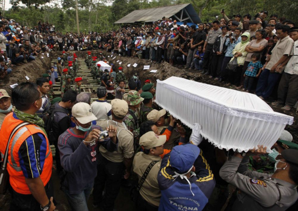 Indonesia mops up after twin catastrophes